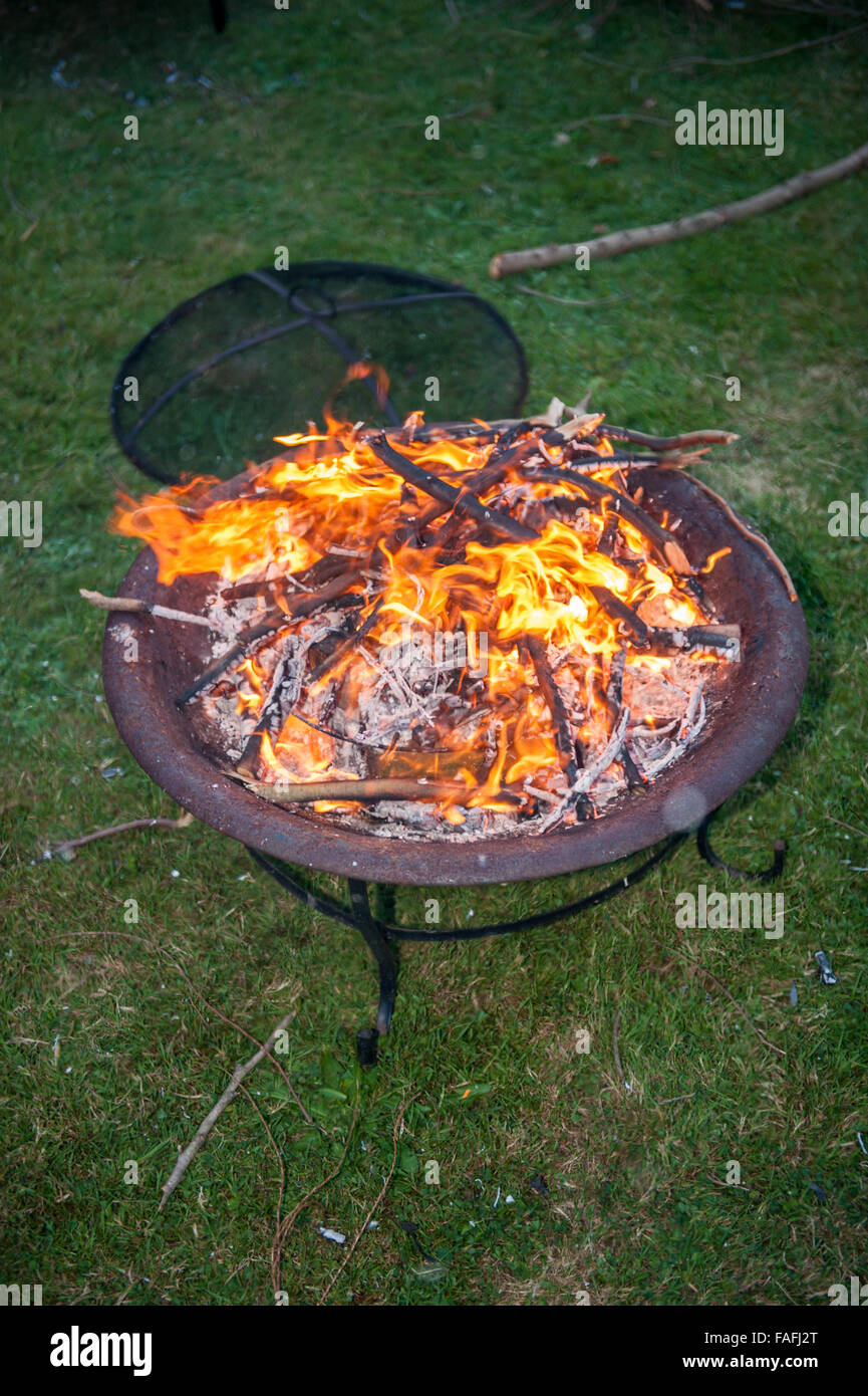 Large Flames flickering on an open garden fire pit Stock Photo - Alamy