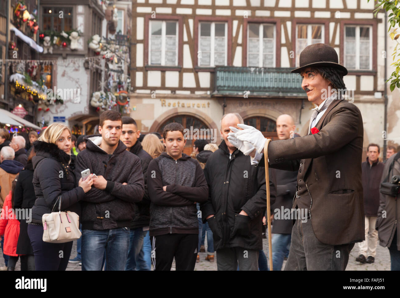 A Charlie Chaplin lookalike performing as a street entertainer ...