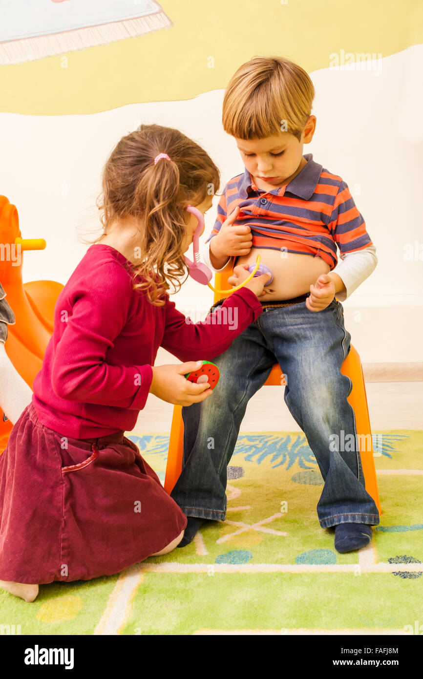 Children playing doctor and patient Stock Photo - Alamy