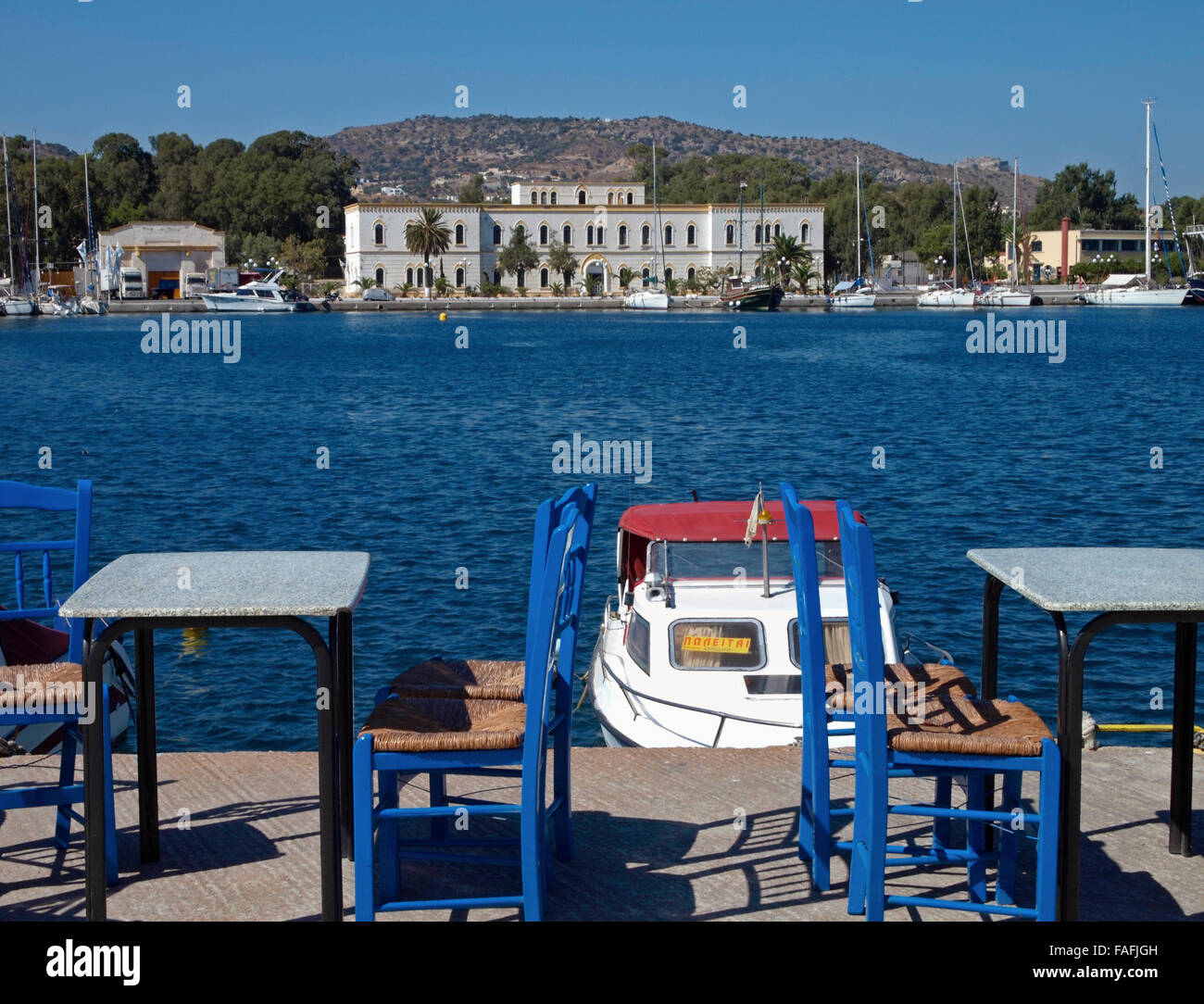 restaurant tables and view of the harbour with the Naval Barracks in ...
