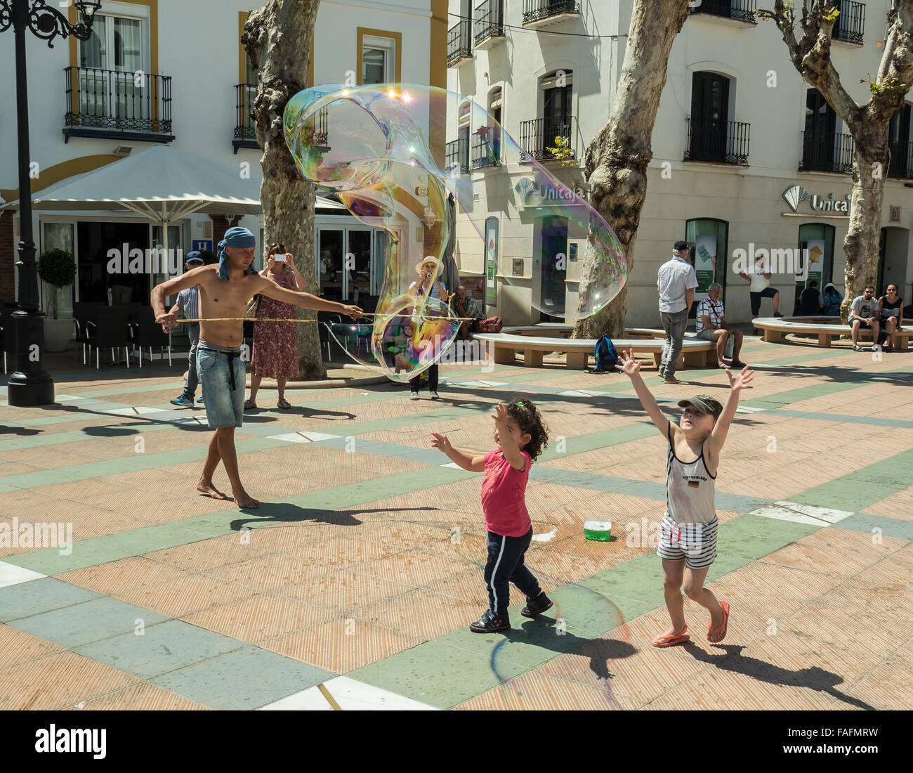 Man with Giant Bubble in the Square, Nerja, Costa del Sol, Spain Stock ...