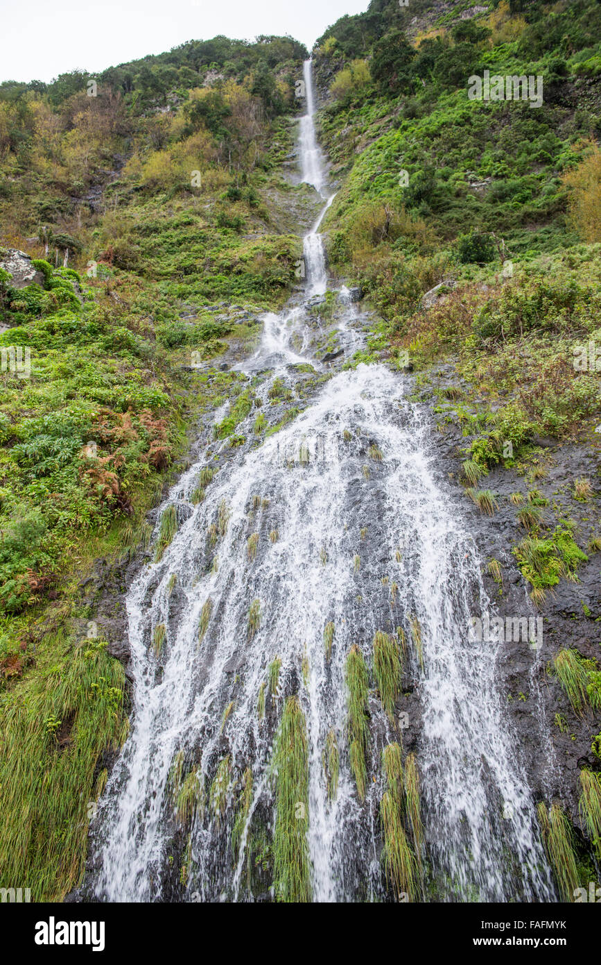 long waterfall falling down side of cliff Stock Photo - Alamy