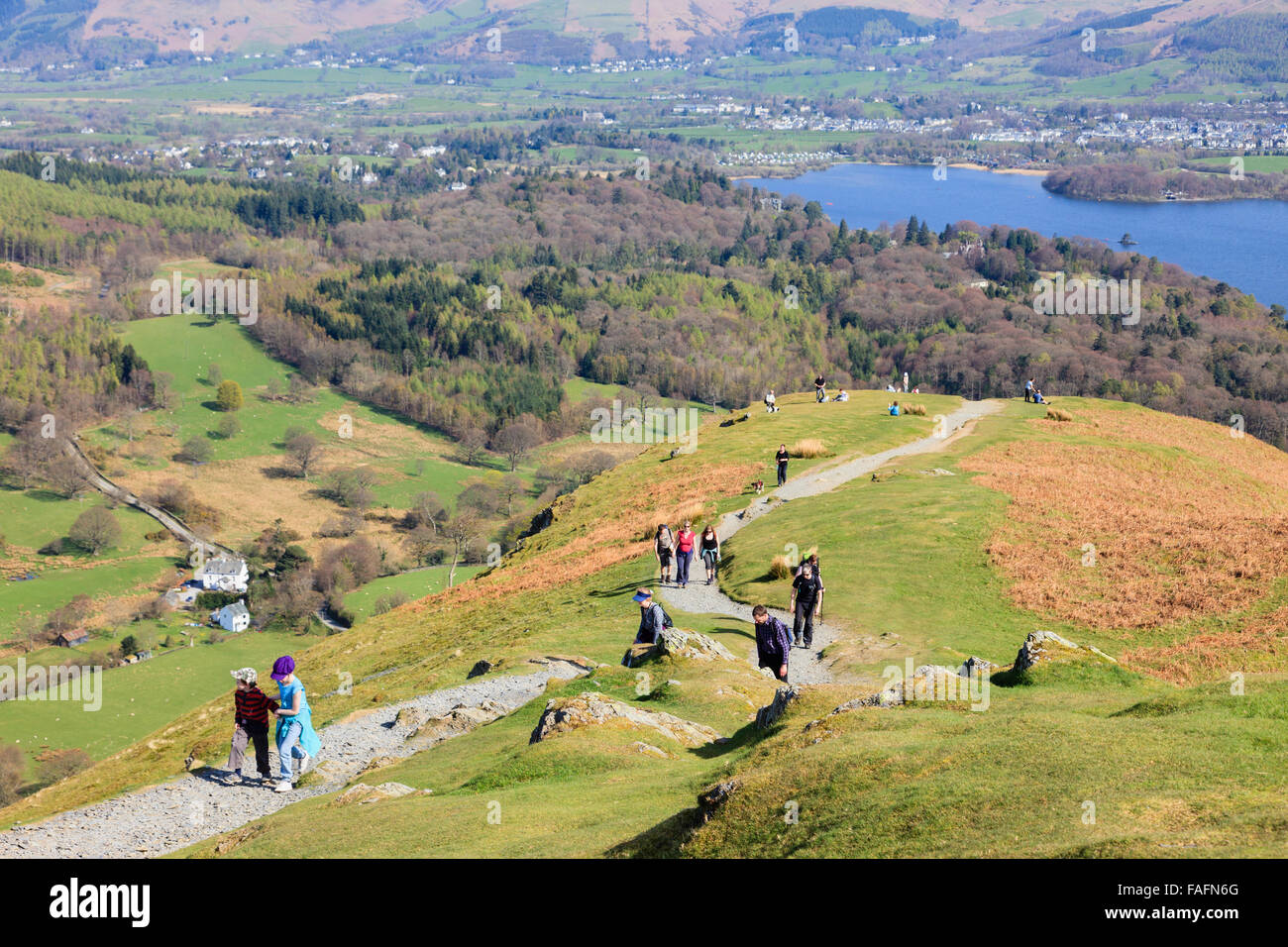 People walking on path up Catbells with view to Derwent Water in ...