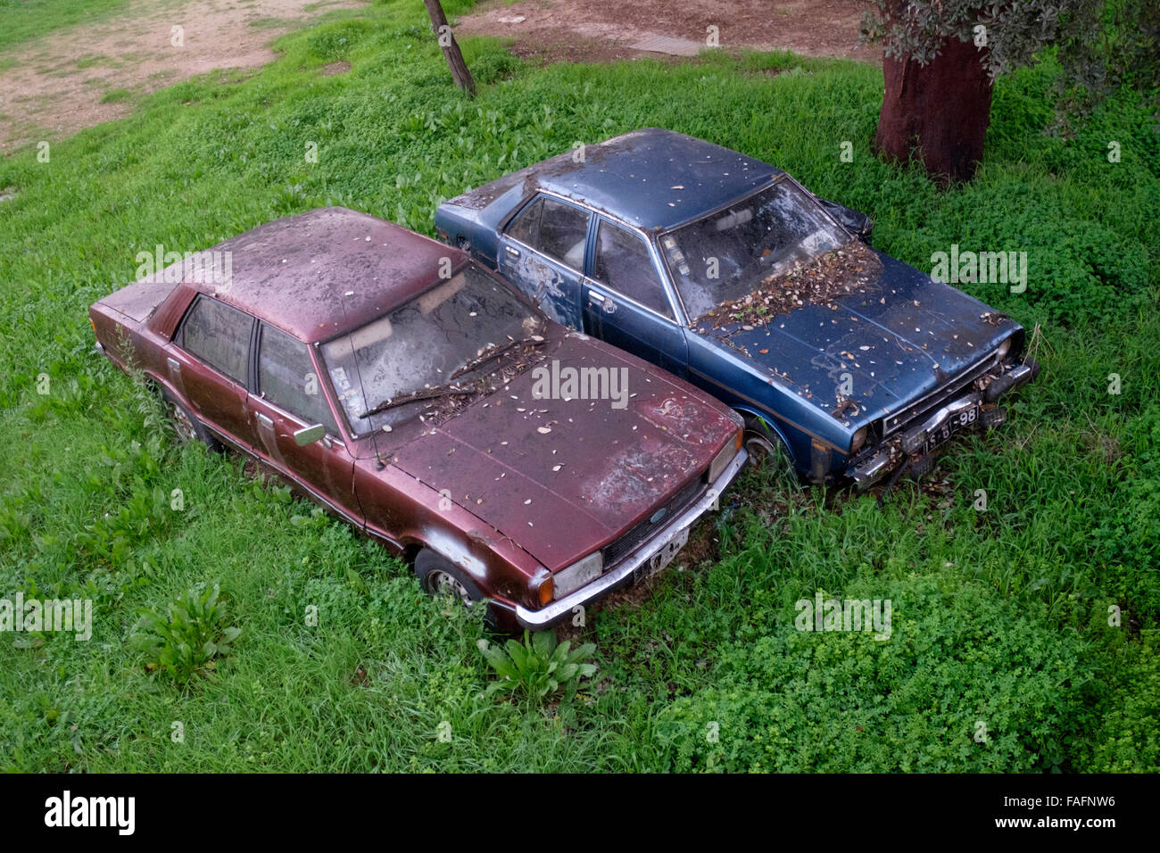 Overhead view of two abandoned old cars side by side Stock Photo - Alamy