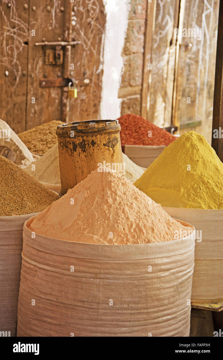 Wooden doors and bags of spices, saffron, in the salt market of the Old ...