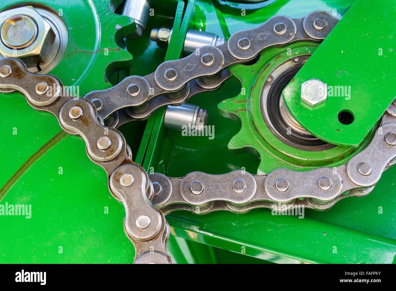 Internal workings of a big baler, showing cogs and chains Stock Photo ...