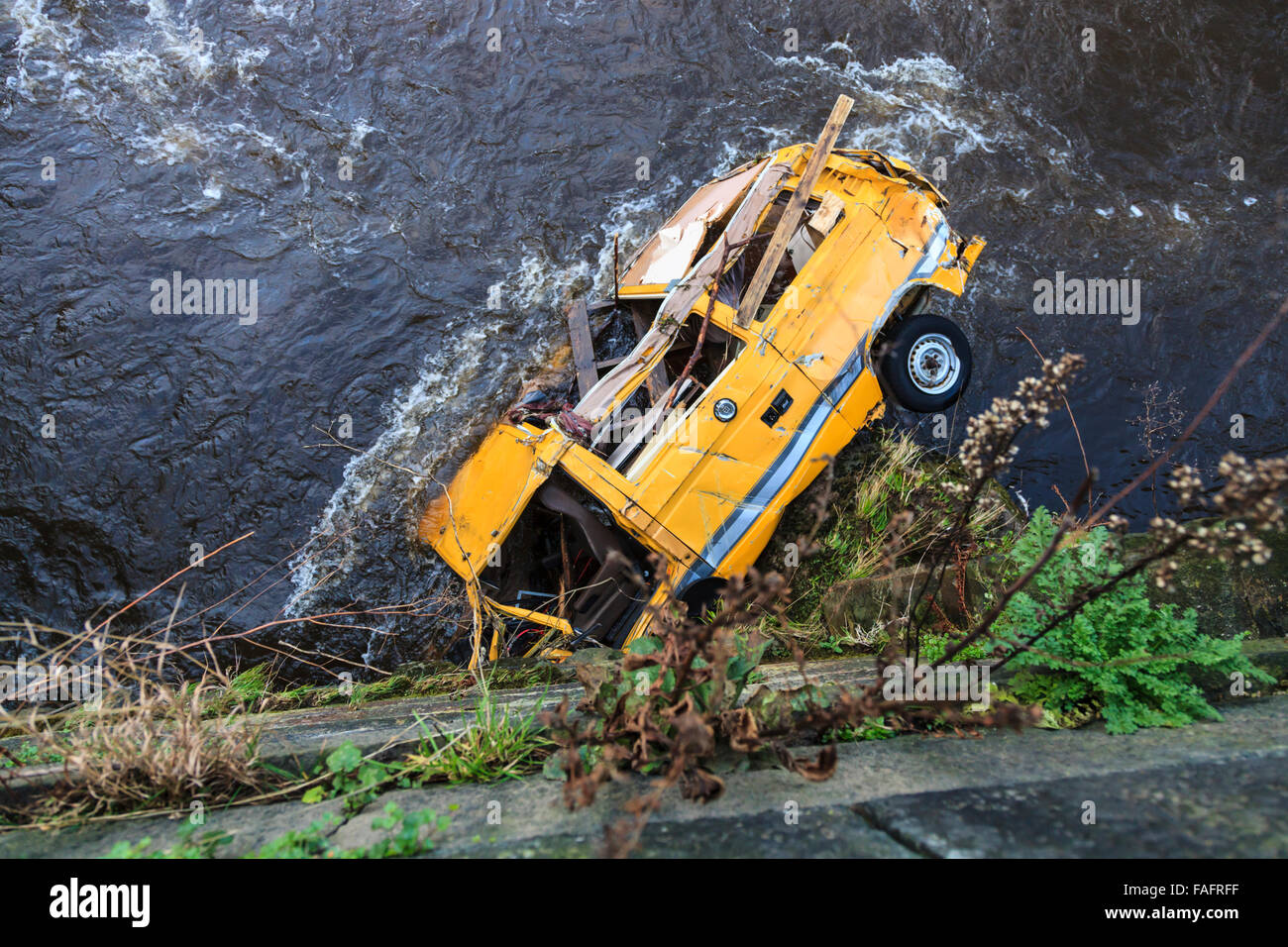 Hebden Bridge, UK. 29th Dec, 2015. A wrecked camper van still stuck ...