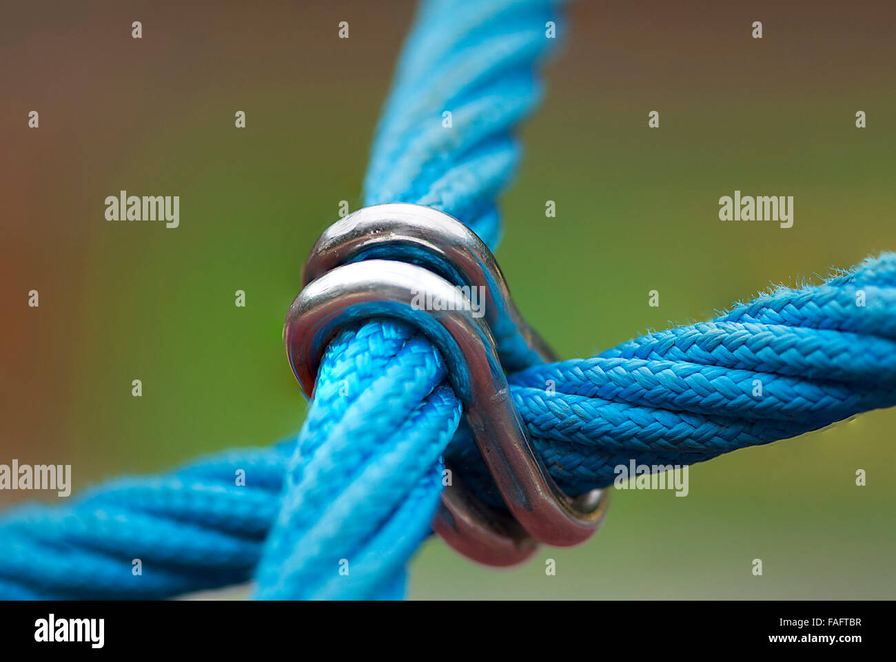 Metal joint on blue plastic fiber Stock Photo - Alamy