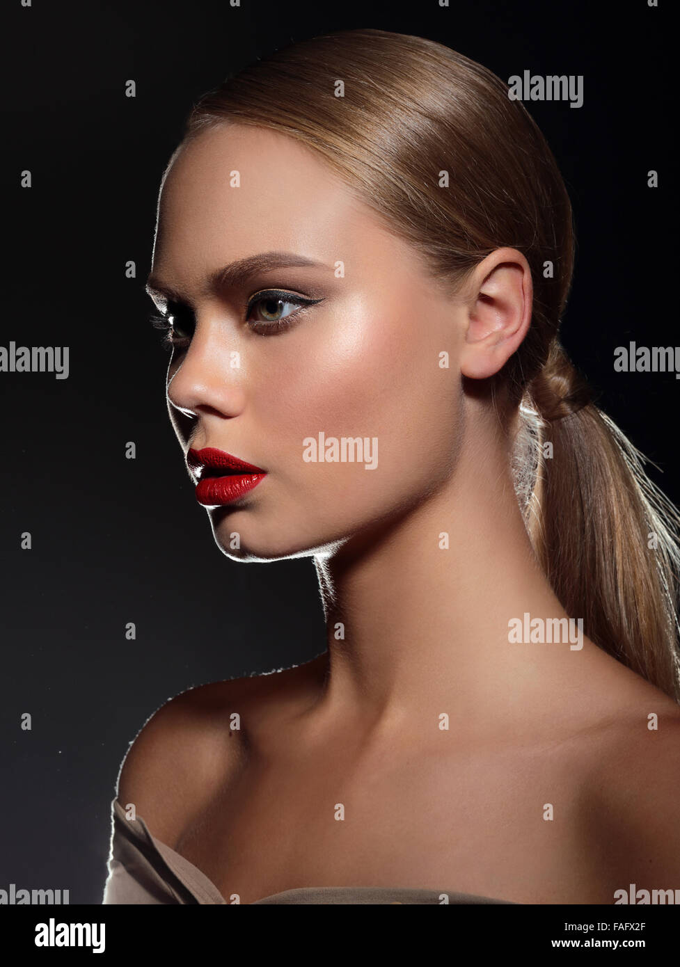 Sensual portrait of a beautiful glamor model woman with red lips with a ...