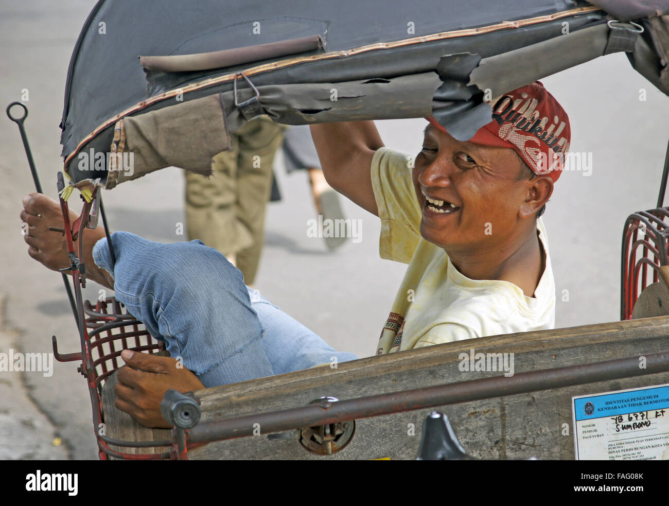 Javanese rickshaw driver having a laugh Stock Photo - Alamy