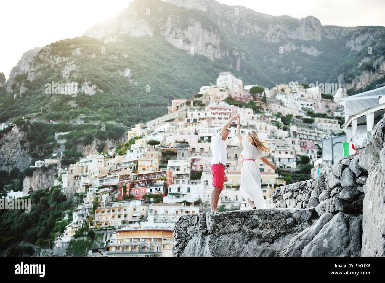 young beautiful happy couple dancing in Positano, Amalfi coast, Italy ...