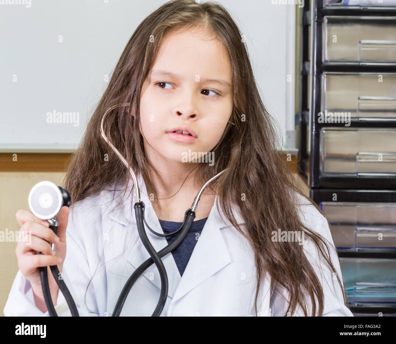 Young girl doctor in lab coat with a stethoscope Stock Photo - Alamy
