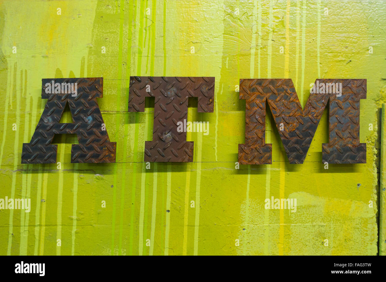 ATM sign made out of old steel metal Stock Photo - Alamy