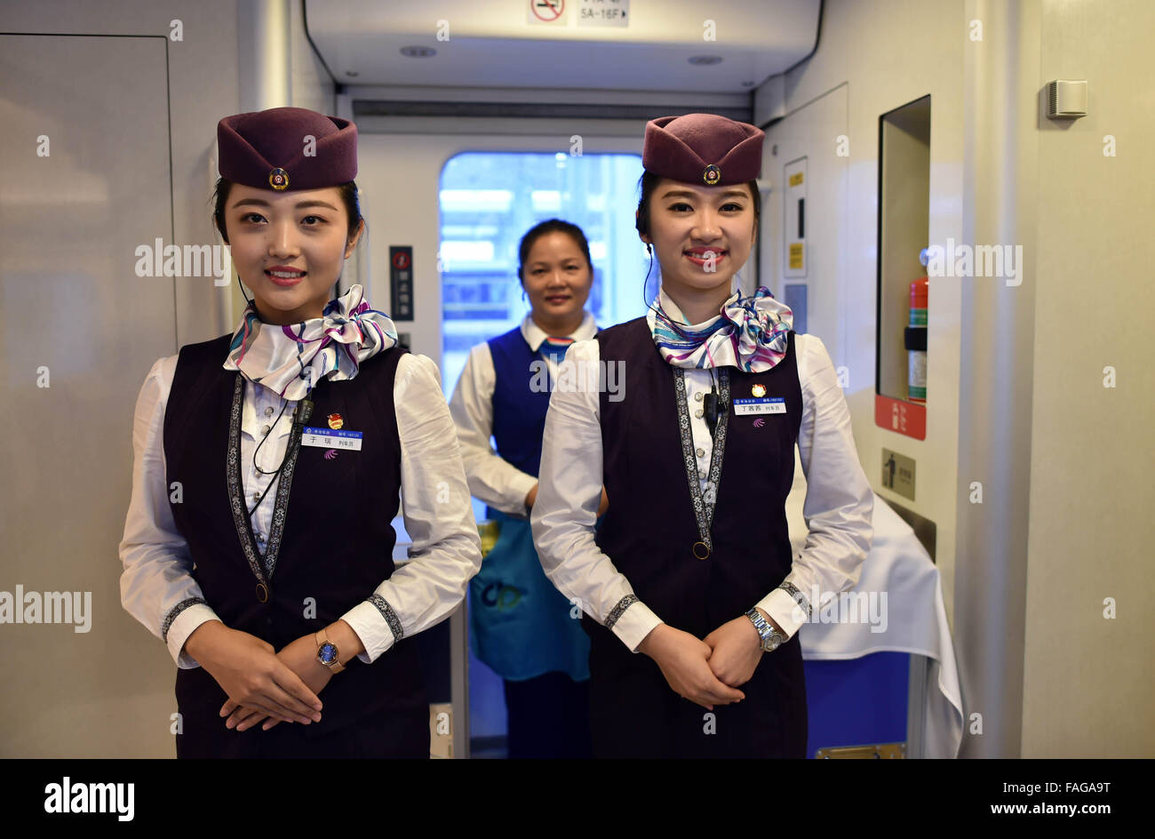 Haikou, China's Hainan Province. 30th Dec, 2015. Steward wait for ...