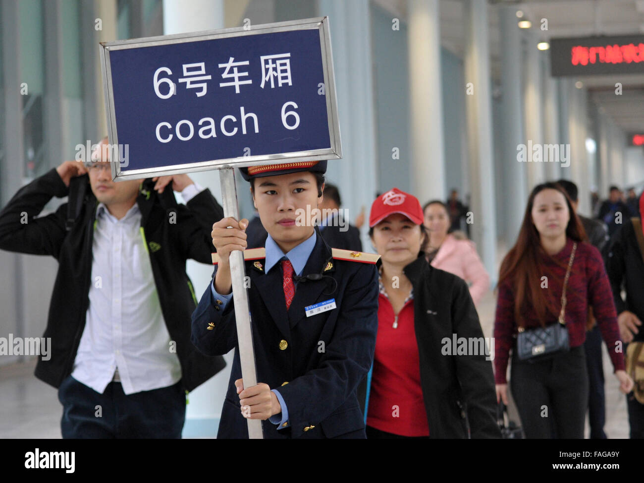 Haikou, China's Hainan Province. 30th Dec, 2015. Passengers prepare to ...