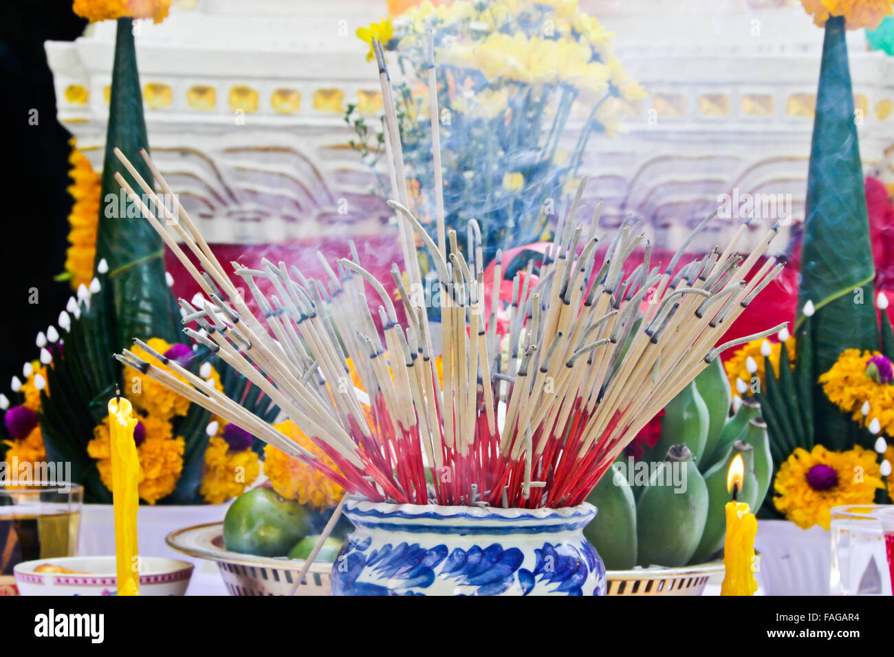 Incense sticks on joss stick pot are burning and smoke use for pay ...