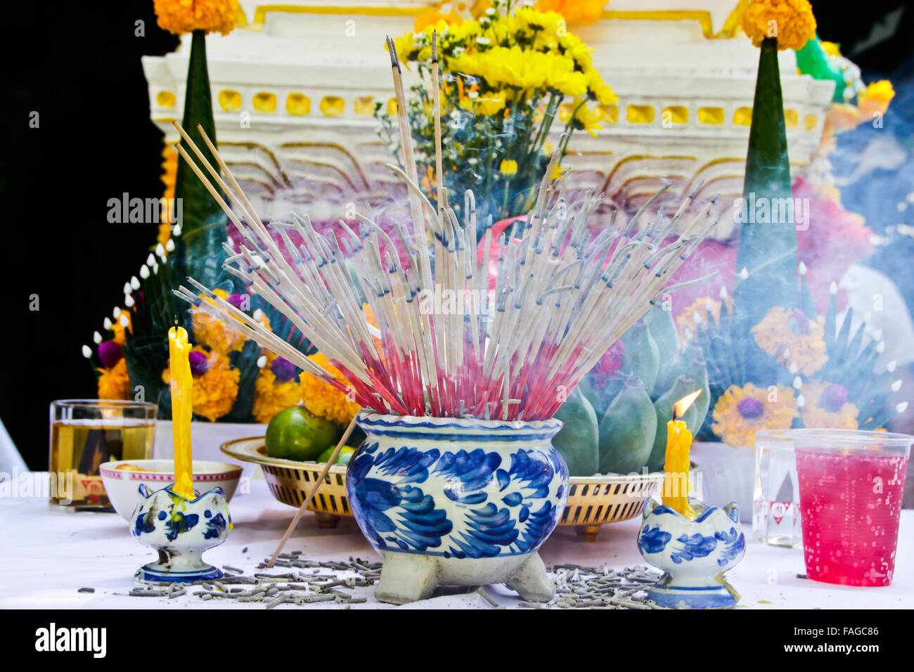 Gold pot joss stick hi-res stock photography and images - Alamy