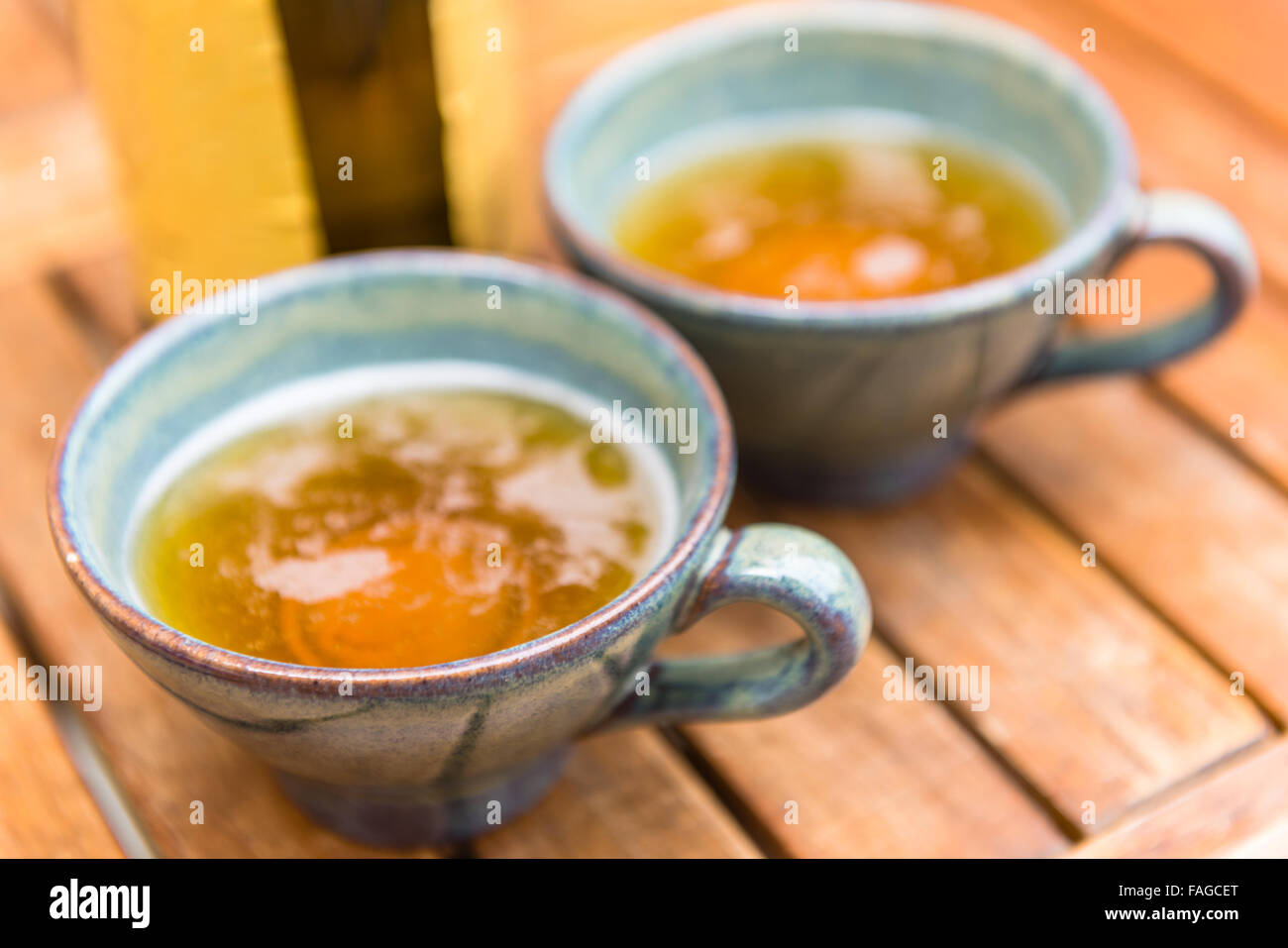 Norman apple cider in a typical ceramic cups. Shot with a selective ...