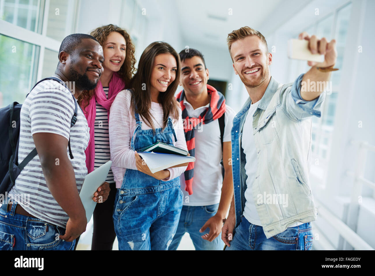 Happy college students making their selfie in corridor Stock Photo - Alamy