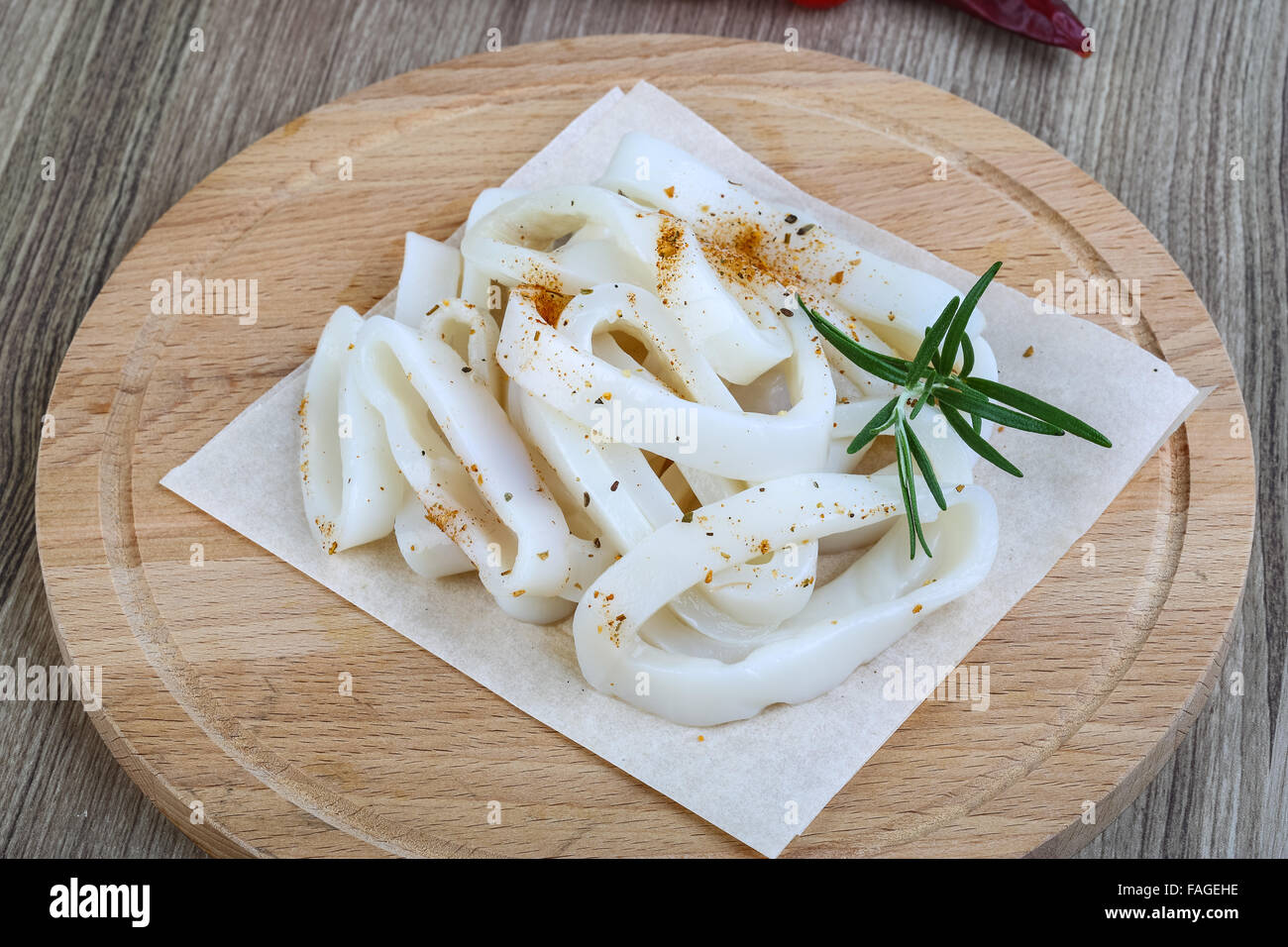 Raw squid rings herbs hi-res stock photography and images - Alamy