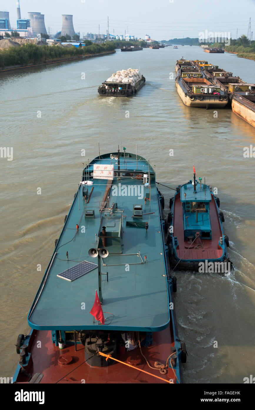 Barge on the Grand Canal, modern city along the river bank, Huai'an ...