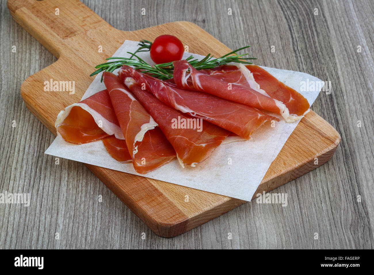 Spanish traditional snack - Jamon with tomato and rosemary Stock Photo ...