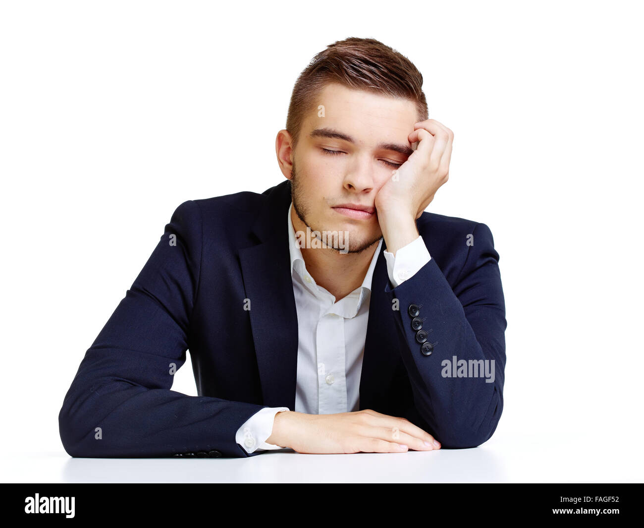 Tired young businessman napping at workplace Stock Photo - Alamy