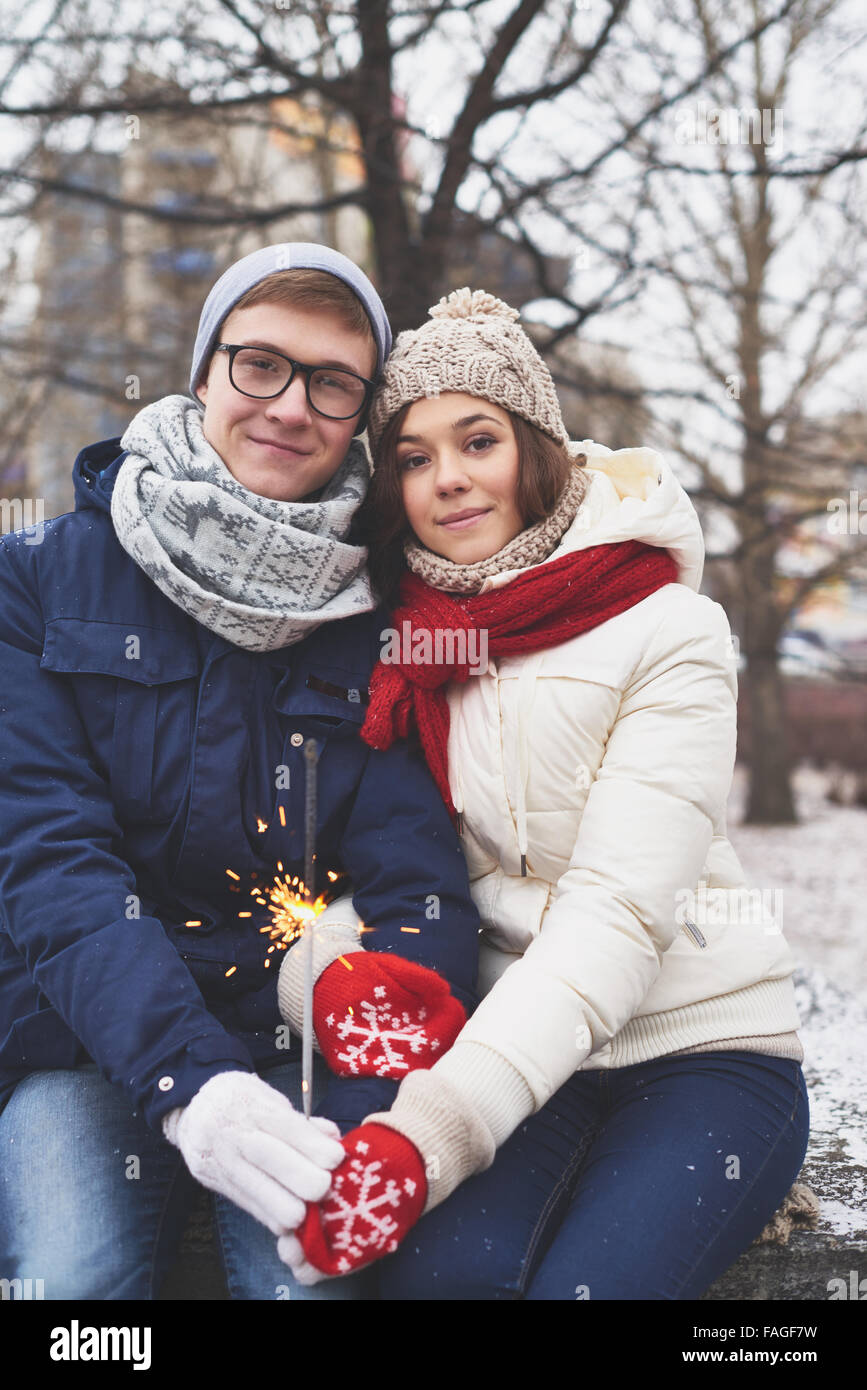 Amorous young dates with Bengal light looking at camera Stock Photo - Alamy