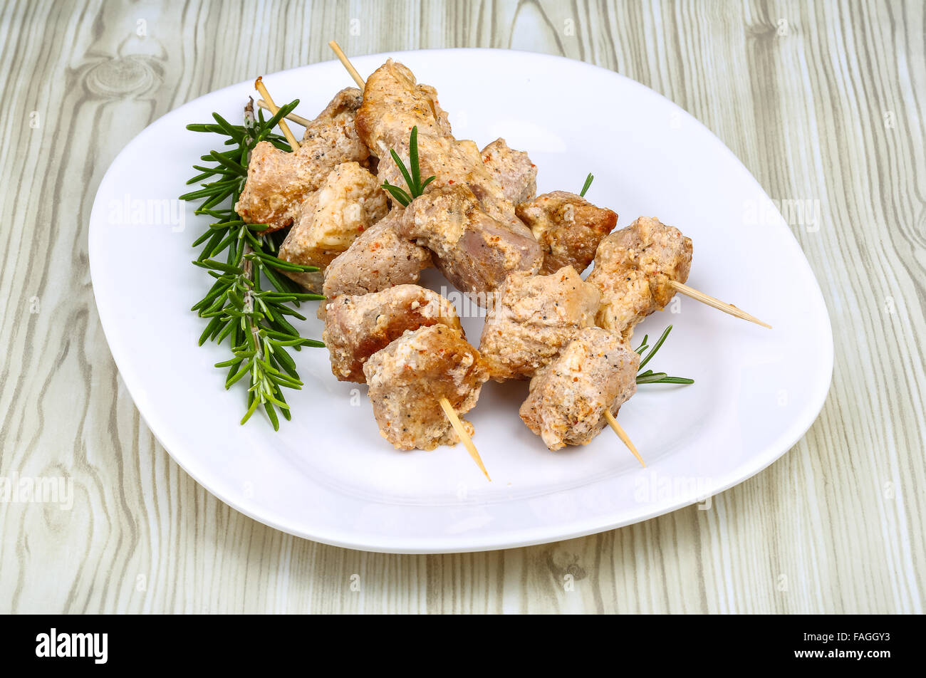 Chicken skewers with rosemary on the wwod background Stock Photo - Alamy