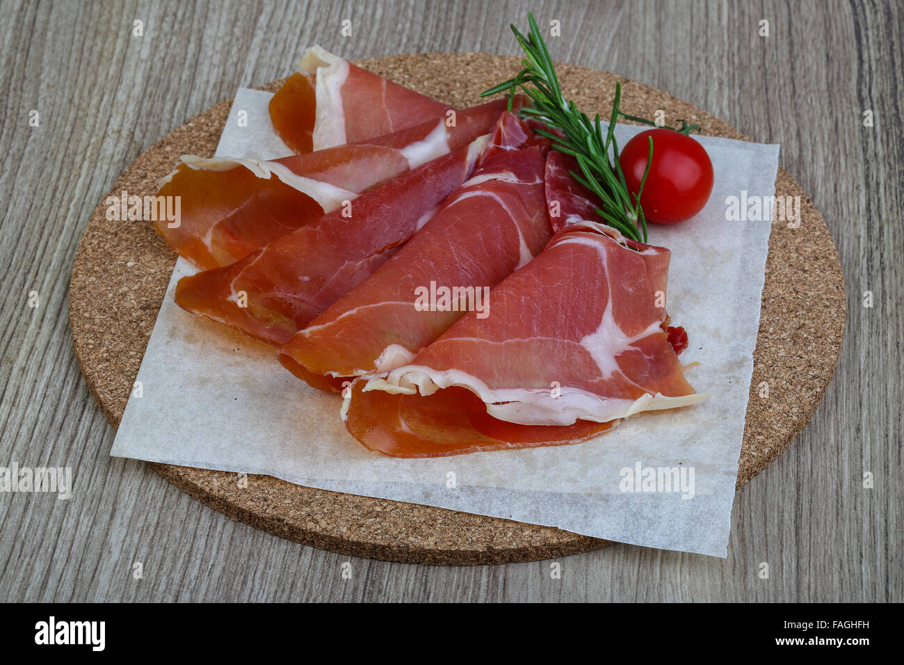 Spanish traditional snack - Jamon with tomato and rosemary Stock Photo ...