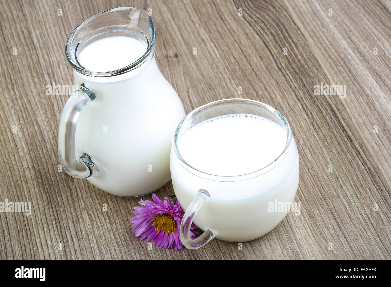 Fresh cold milk in glass on the wood background Stock Photo - Alamy