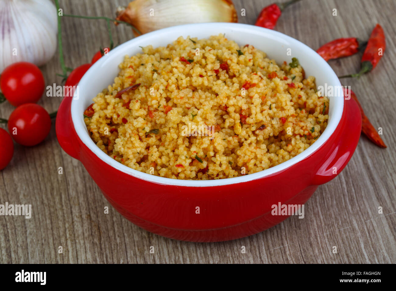 Arabic traditional cuisine - Couscous with tomato and green onion Stock ...