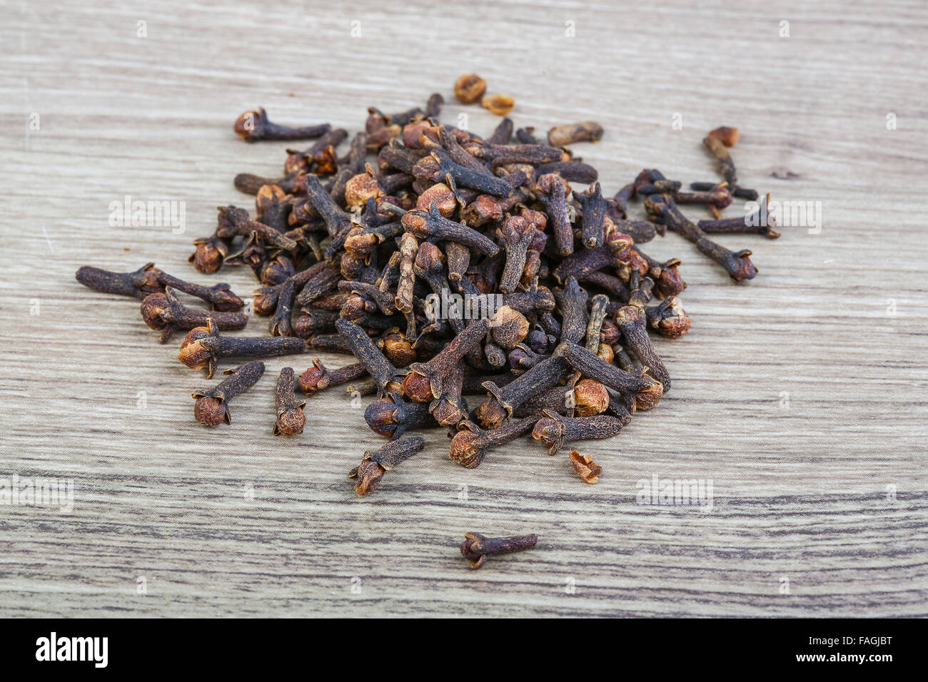 Aromatic Dried Cloves seeds on the wood background Stock Photo - Alamy