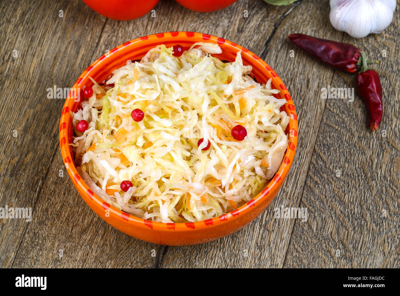 Fermented cabbage - Sauerkraut with herbs and spices on the wood ...