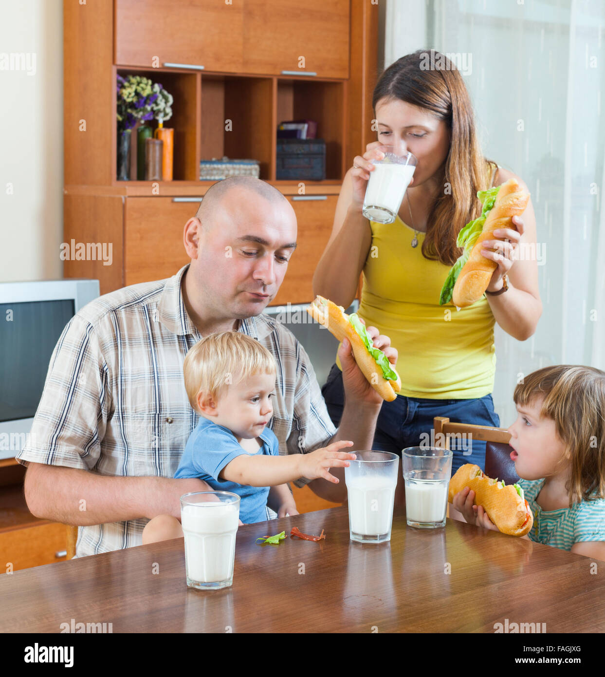 Cheerful father daughter eating sandwiches hi-res stock photography and ...