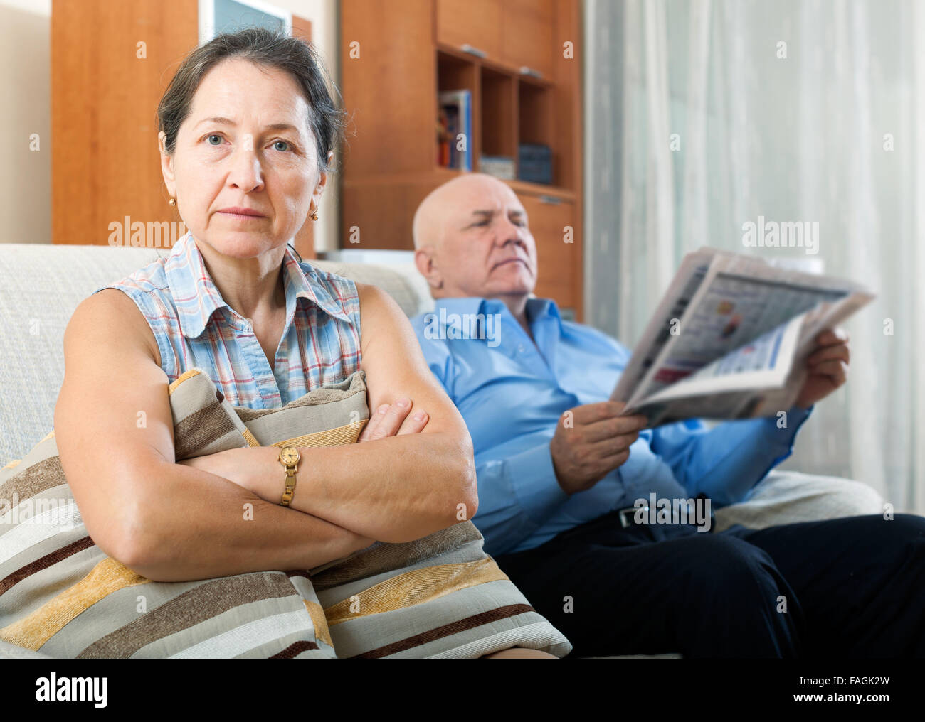 Portrait of sad mature woman at home interior Stock Photo - Alamy