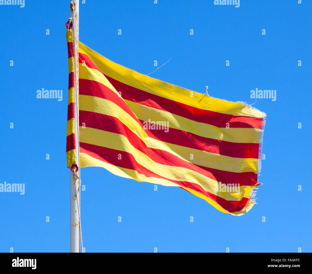 flying Catan flag against blue sky Stock Photo - Alamy