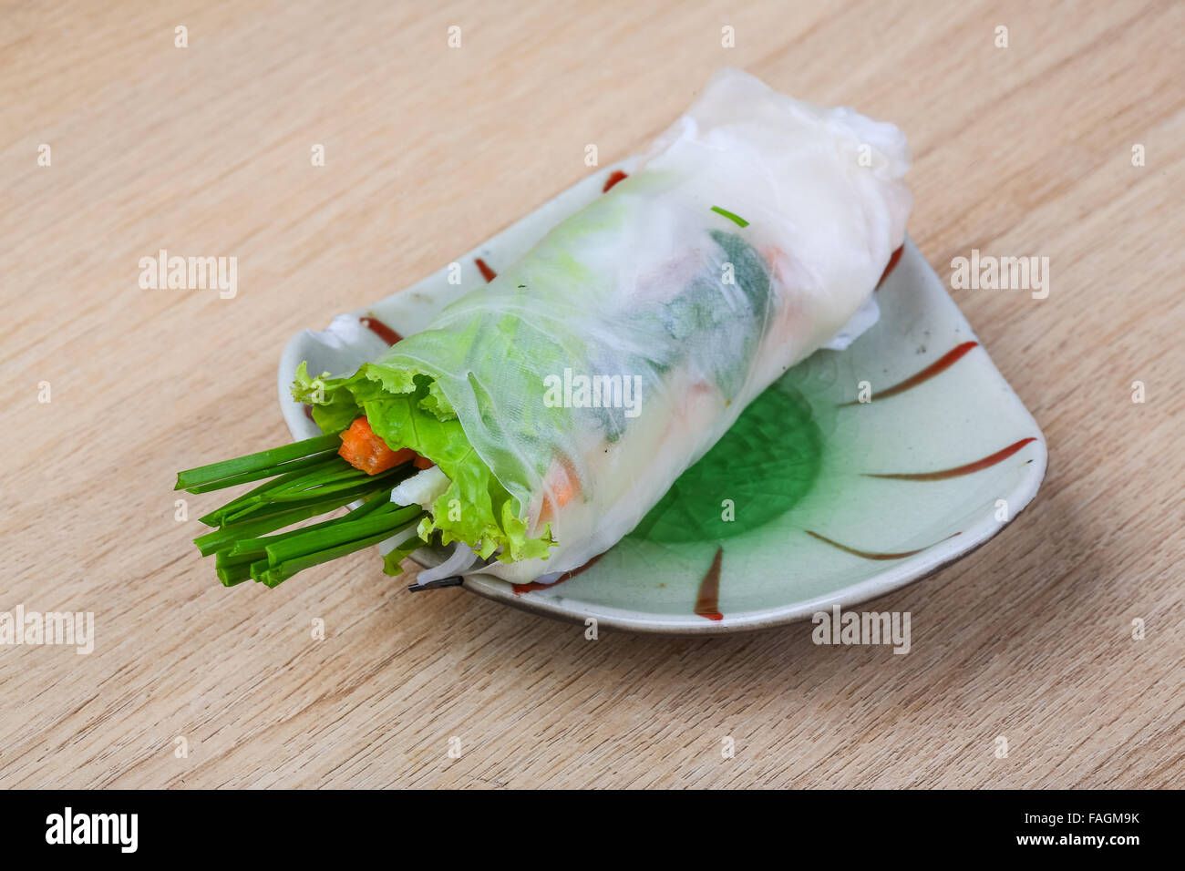 Asian traditional spring rolls on the wood background Stock Photo - Alamy