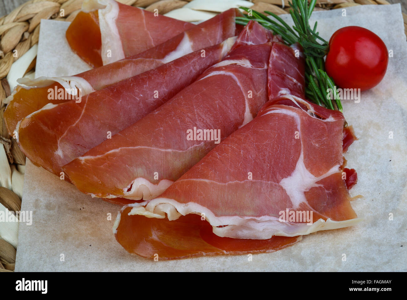 Spanish traditional snack - Jamon with tomato and rosemary Stock Photo ...