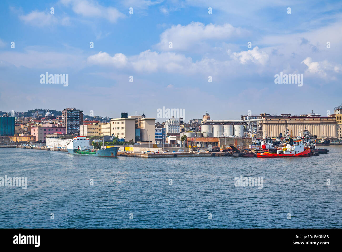 Port of Naples, coastal cityscape with cargo ships along coastline ...
