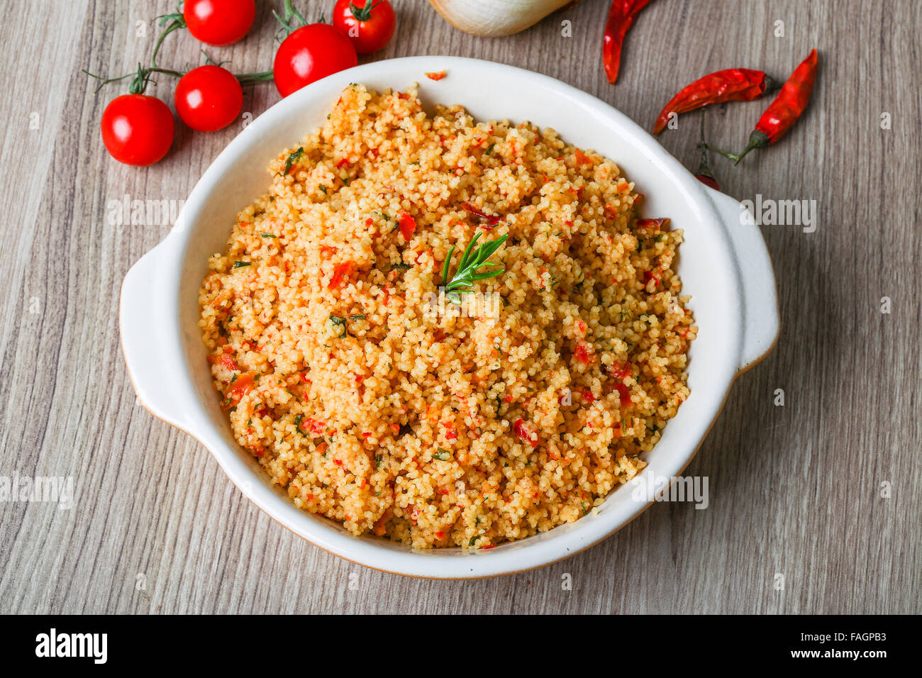 Arabic traditional cuisine - Couscous with tomato and green onion Stock ...