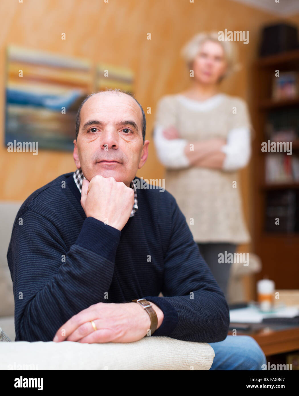 Family quarrel. Unhappy senior man with angry wife at home Stock Photo ...