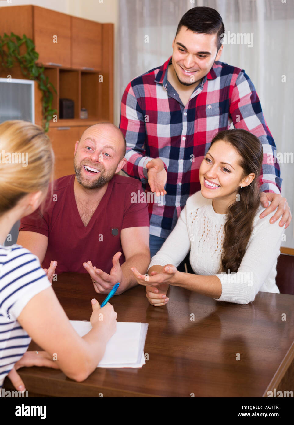 Positive agent explaining to group of people the contract terms Stock ...