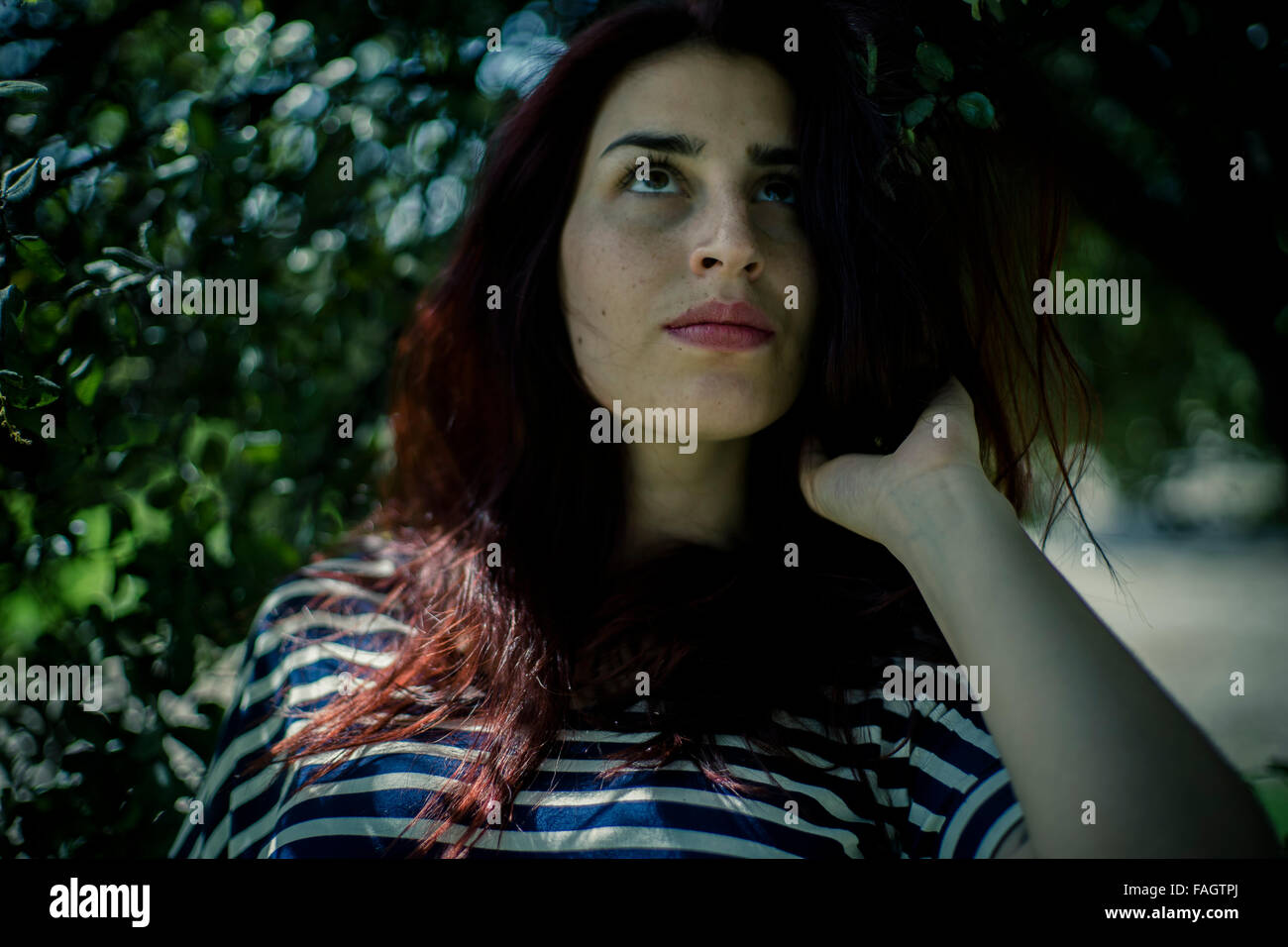 romantic girl with branches of a tree in a park Stock Photo - Alamy