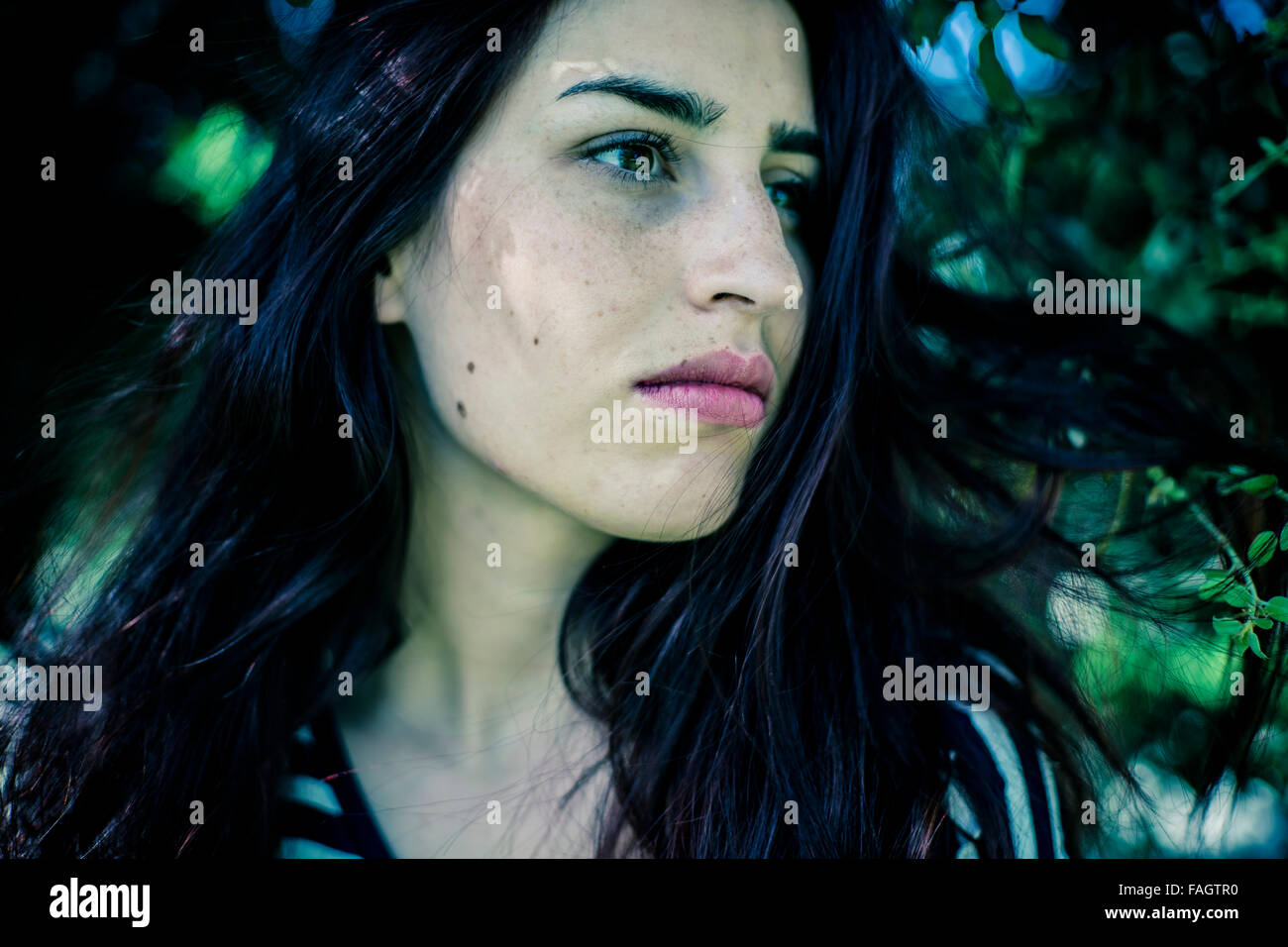 girl with sad eyes and distressed face outdoor park Stock Photo - Alamy