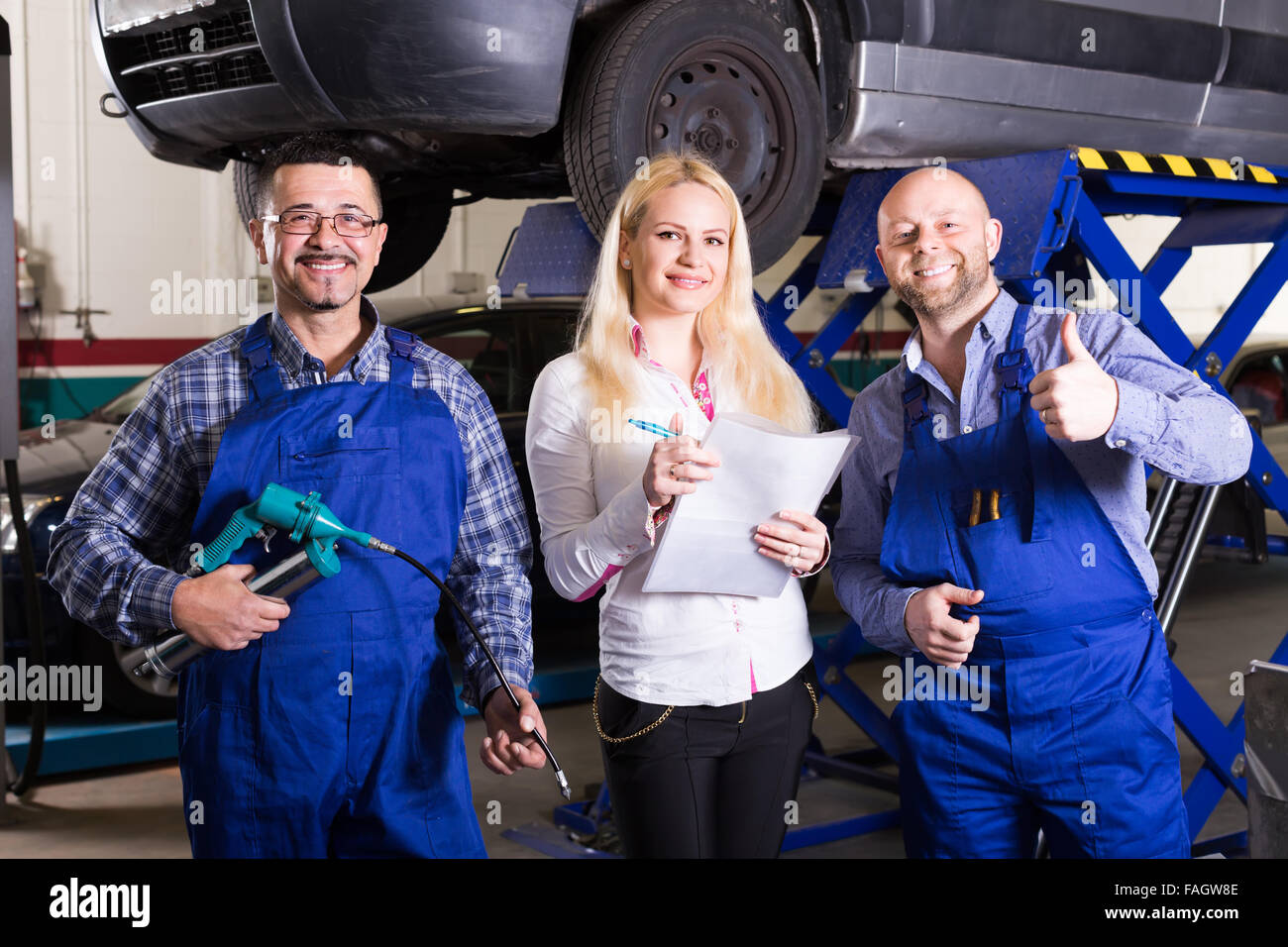 Attractive female insurance agent discussing with smiling auto ...