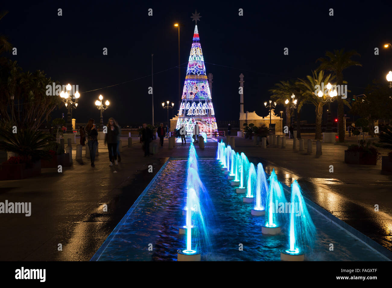Christmas tree and coloured water fountains at night in Cadiz Spain ...