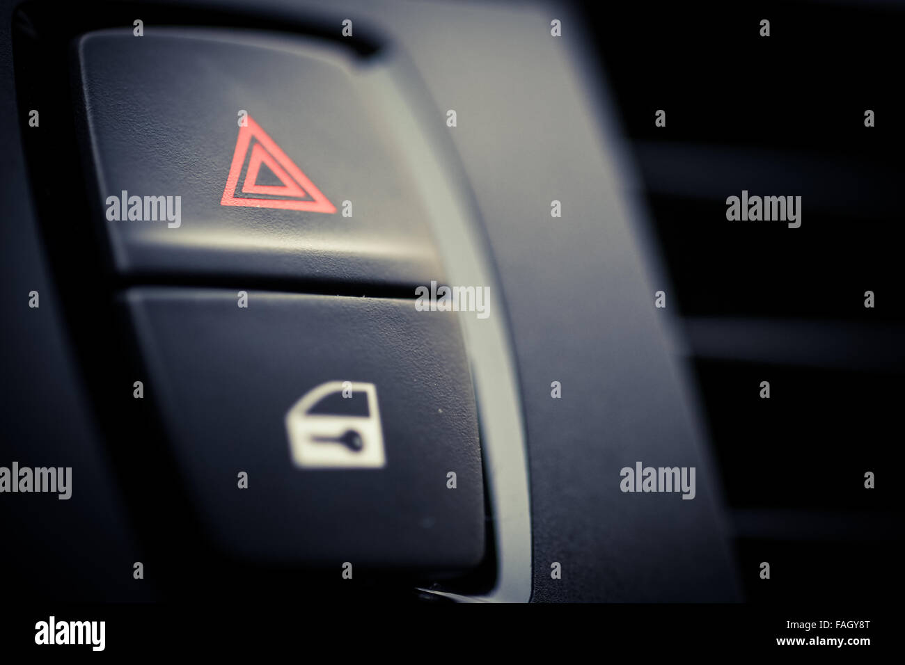 Detail of a warning button in a car Stock Photo - Alamy
