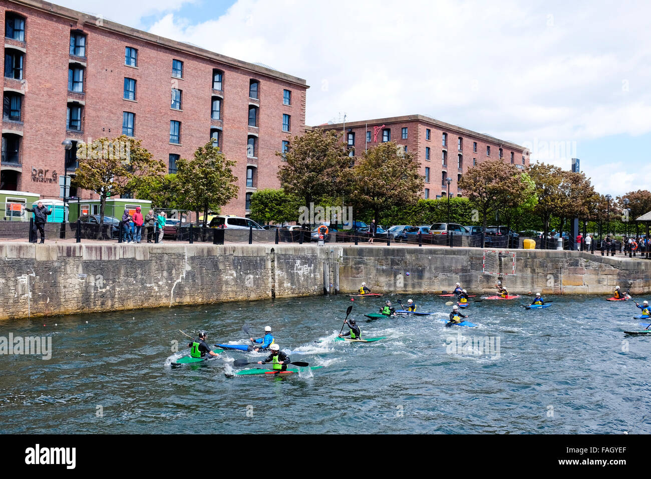 Teams of Kayakers compete at a kayak water polo match in the canals of ...