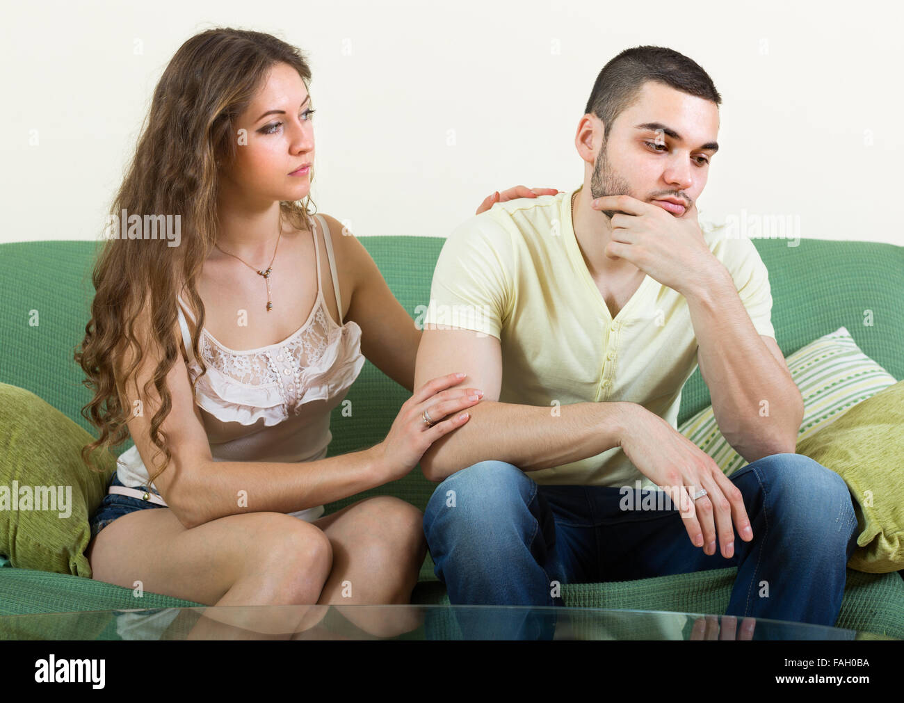 Loving young woman tries reconcile with offended man at home Stock ...